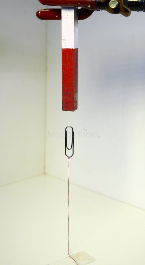 Invisible Magnetic forces stock image. Image of paperclip - 121699443