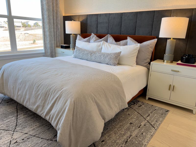 Inviting Bedroom with Plush Bedding and Elegant Decor Stock Photo ...