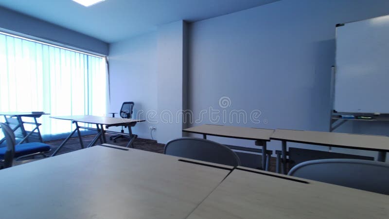 An Empty Classroom at School with Desks and a Globe on the Teacher S ...