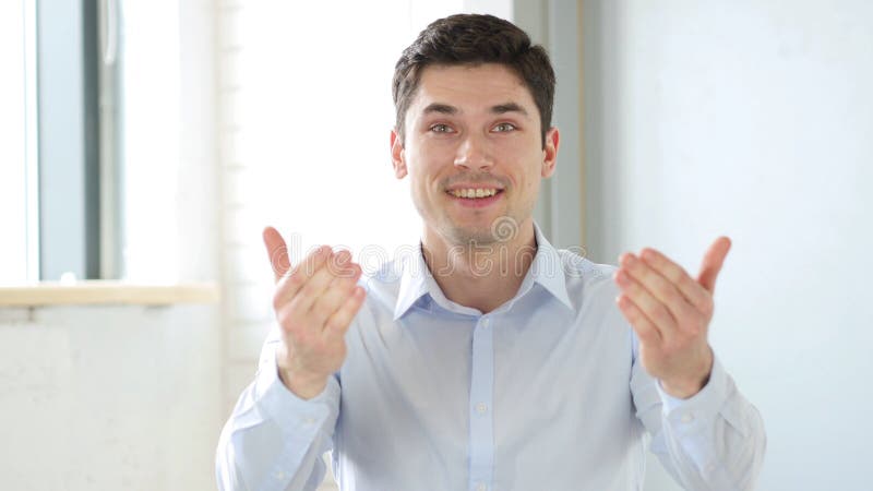 Inviting Man in Office with Hands, Indoor Stock Photo - Image of ...