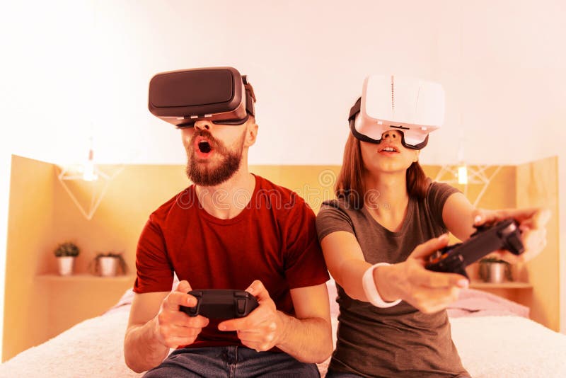 Involved Couple Playing Virtual Reality while Having a Day Off Stock ...