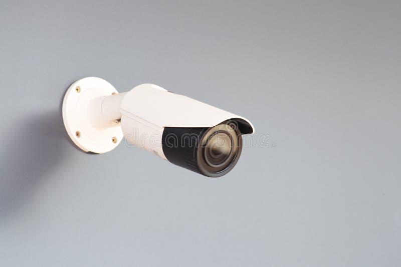 IP CCTV White Camera Installed on a Gray Wall - Home Security System ...