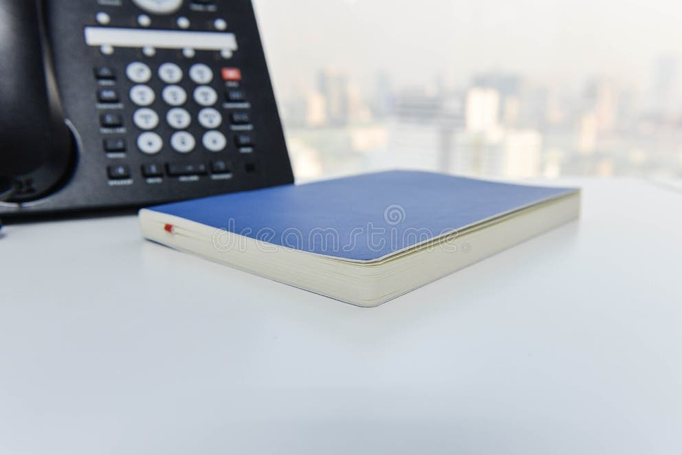 IP Phone and Blue Notebook on the White Table Stock Image - Image of ...