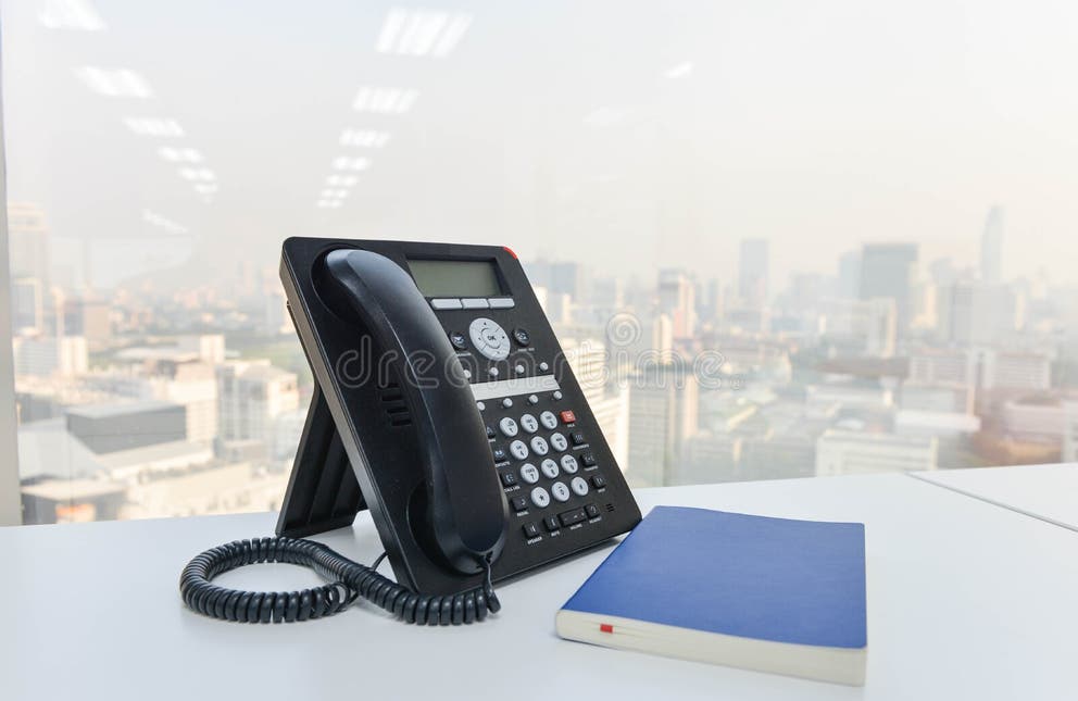 IP Phone and Blue Notebook on the White Table Stock Image - Image of ...