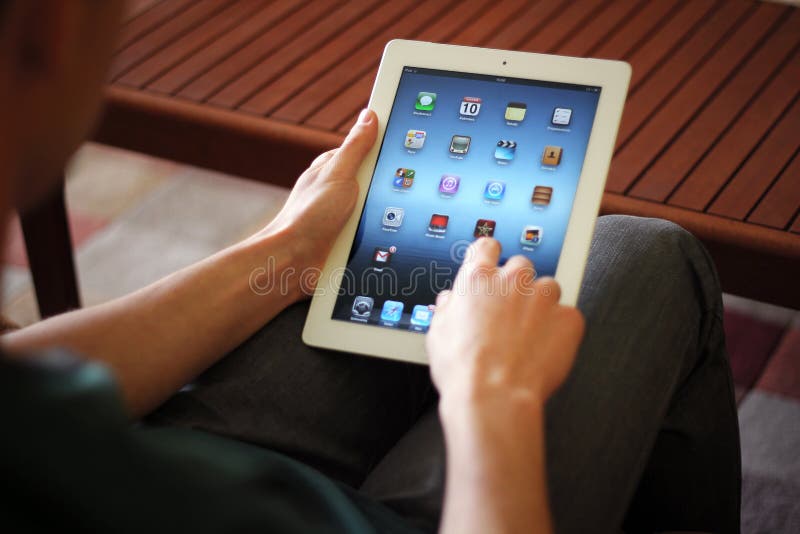 A new Ipad on hand editorial stock image. Image of browse - 22076504