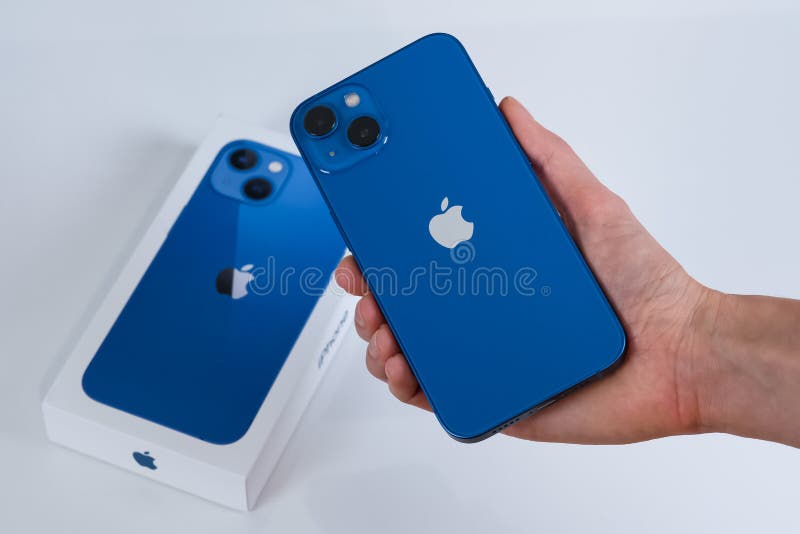 IPhone 13 in blue editorial photography. Image of screen - 230699857