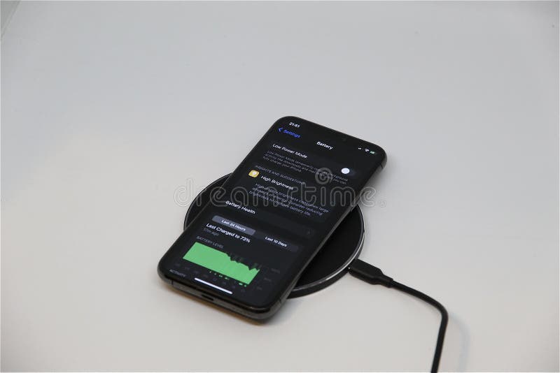 IPhone Charging on Wireless Charger Editorial Photography - Image of ...