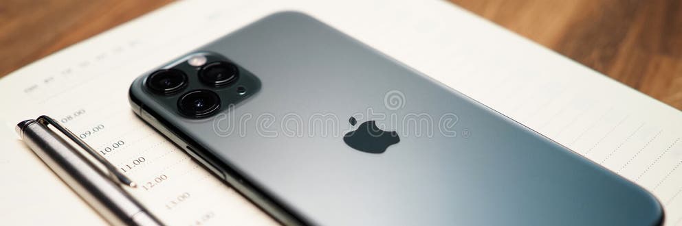 IPhone Pro Device Lying at Opened Notebook Editorial Photo - Image of ...