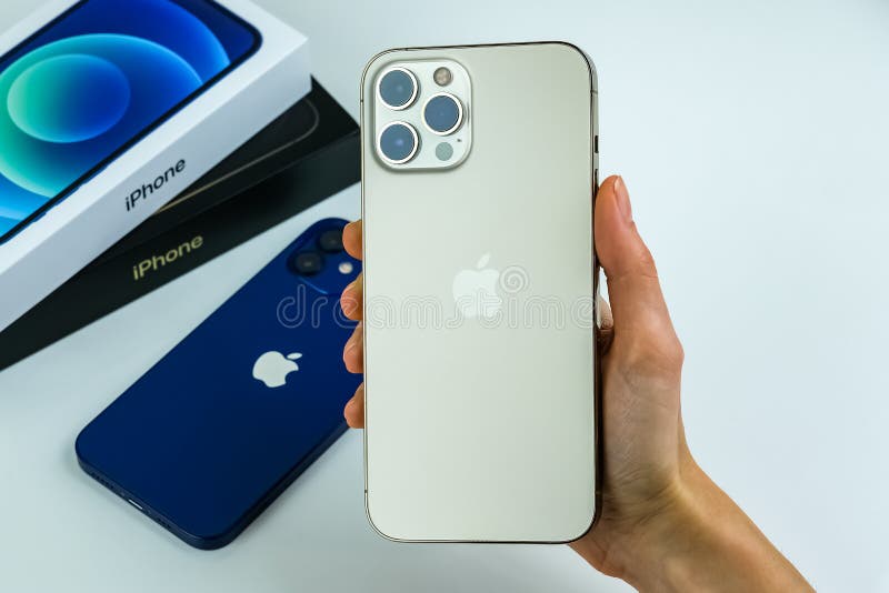 IPhone 12 Pro Max Gold Next To Iphone 12 in Blue Editorial Stock Photo ...