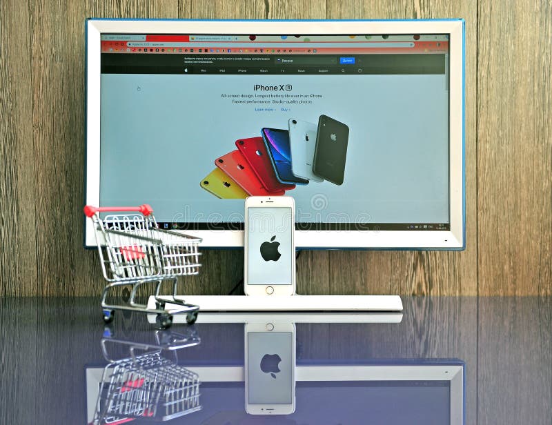 IPhone 6S with Apple Logo and Computer Screen with Apple Website ...