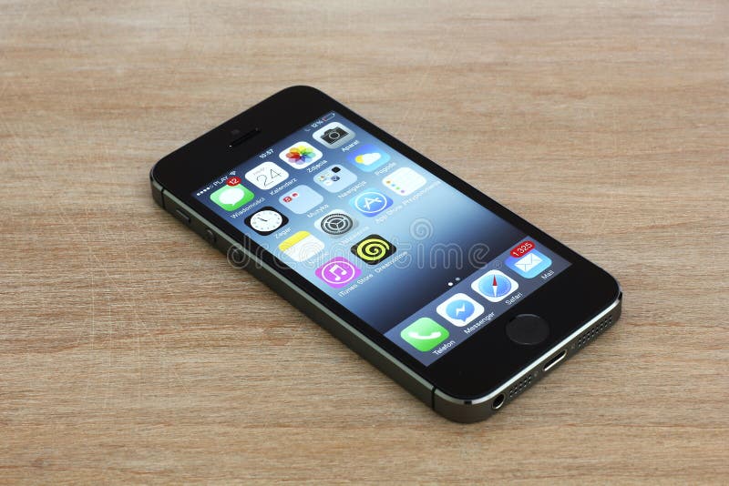IPhone 5s lying on a table editorial image. Image of retina - 43795145