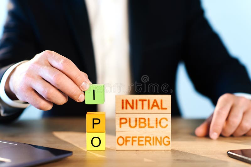 Ipo Concept. a Man Stacks Wooden Blocks with the Words Initial, Public ...