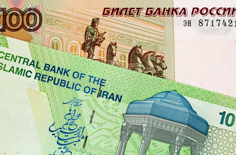 Iranian 10000 Rial Note with a Russian 100 Ruble Note Stock Image ...
