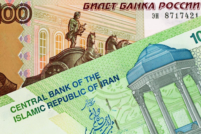 Iranian 10000 Rial Note with a Russian 100 Ruble Note Stock Photo ...