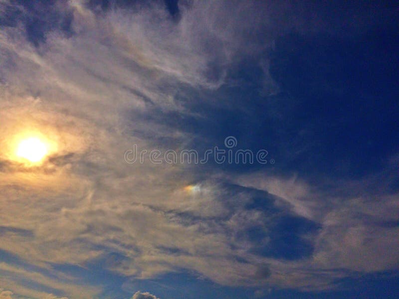 Iridescent Cloud and Sunlight Stock Photo - Image of blue, cloud: 52708392