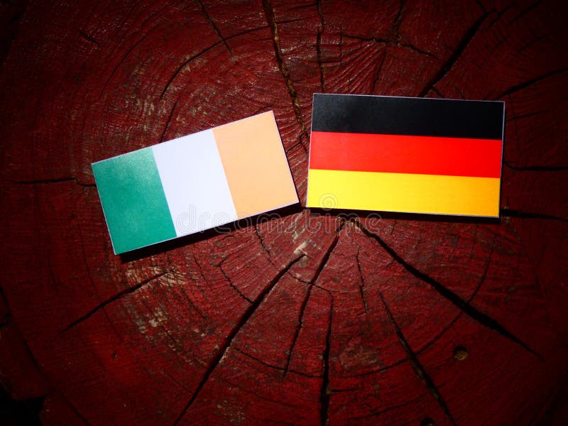 Irish Flag with German Flag on a Tree Stump Stock Photo - Image of ...