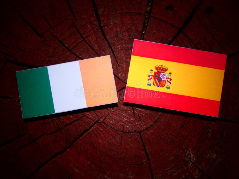 Irish Flag with Spanish Flag on a Tree Stump Stock Photo - Image of ...