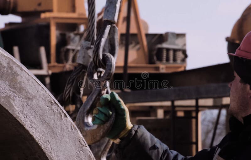 Slinger at Work. Stroply Cargo. Worker in a Helmet Editorial Image ...