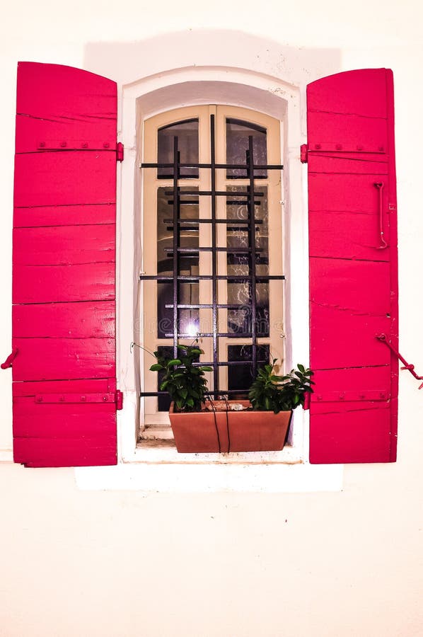 Iron Barred, Tall Pair of Windows with Open Red , Wood Shutters Stock ...