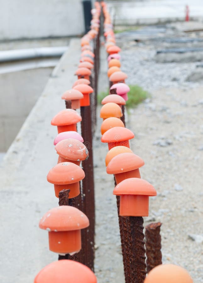 Iron Bars on a Work Whith Plastic Caps Stock Image - Image of safety ...