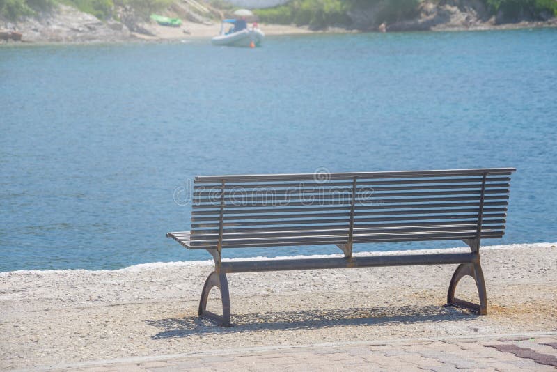Iron Bench Near Blue Sea Water for Rest after a Walk Stock Photo ...