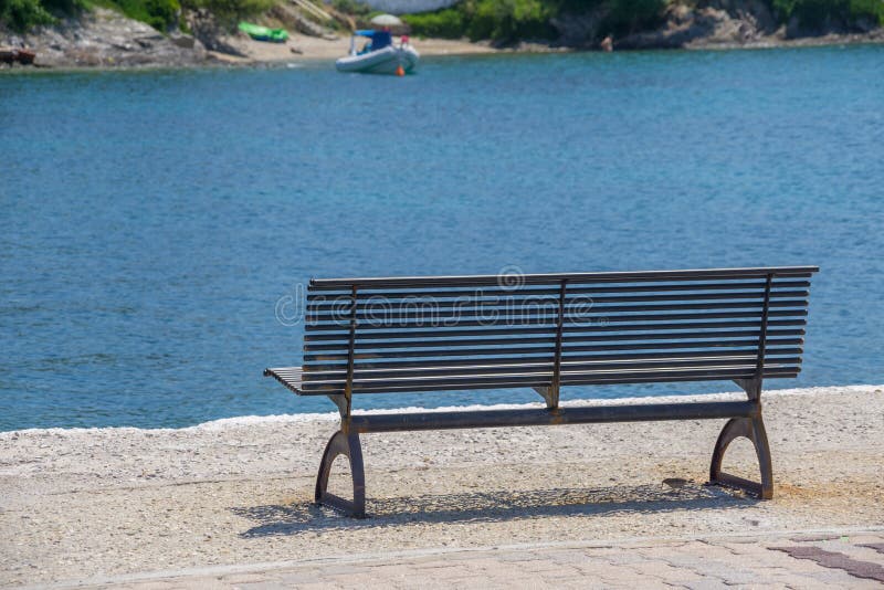 Iron Bench Near Blue Sea Water for Rest after a Walk Stock Image ...