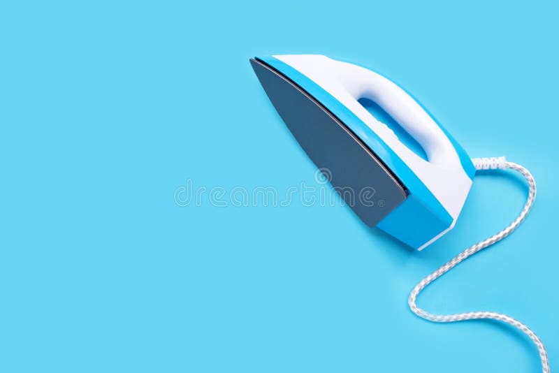 Iron on Blue Background. Top View with Stock Image - Image of chores ...