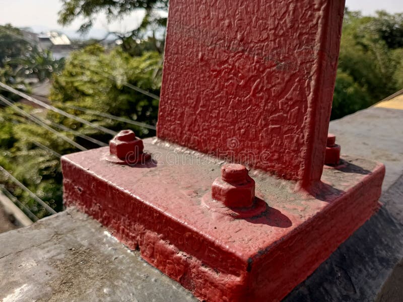 Iron Bridge Pillar Fence with Several Bolts and Nuts Painted Red Stock ...