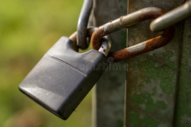 A padlock on a gate stock photo. Image of close, steel - 170076782