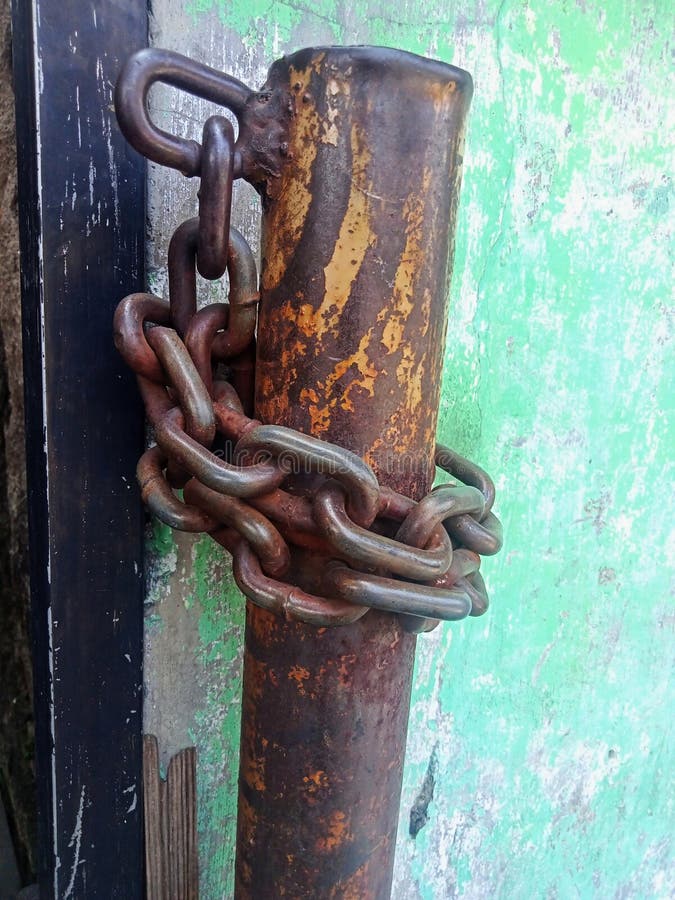 Iron Chains Wrapped Around Rusty Iron Pillars Stock Photo - Image of ...