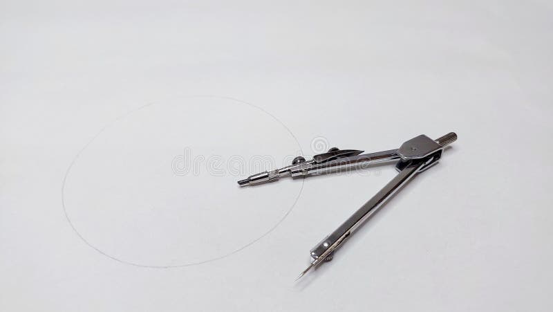 Iron Compasses on White Paper Stock Photo - Image of close, lighting ...