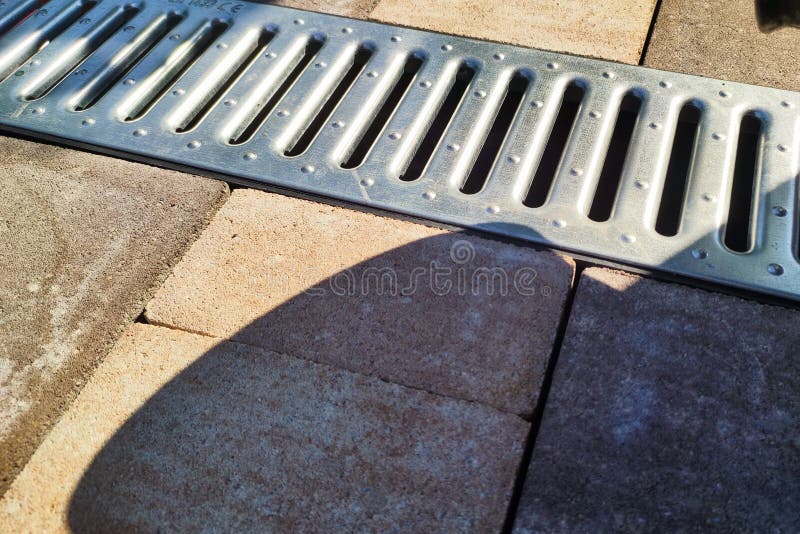 Iron Drainage Net. Drain for Water after Rain on the Sidewalk ...