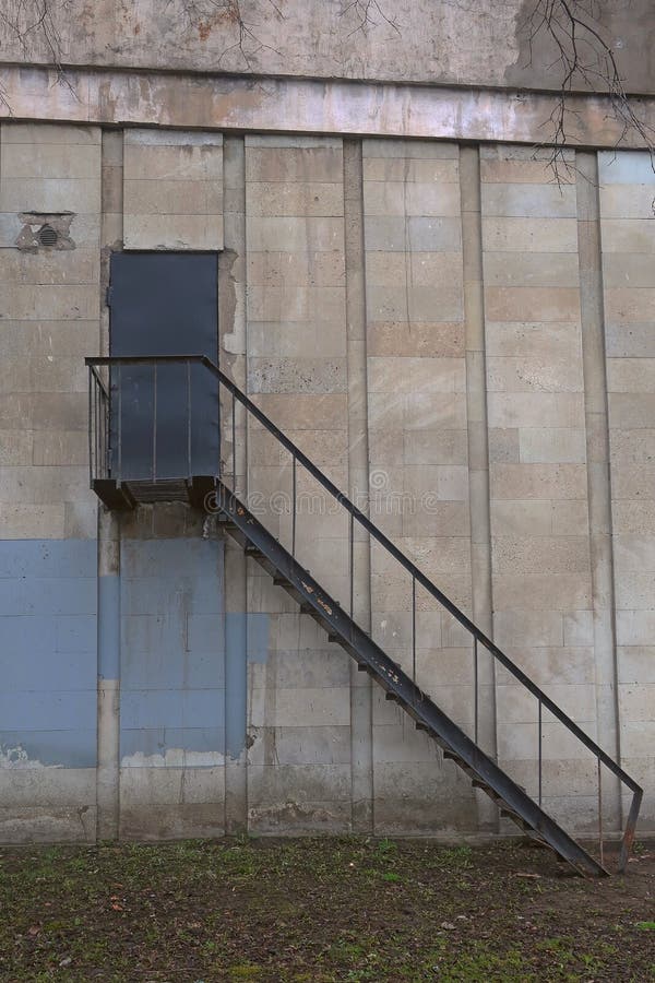 Iron Escape Ladder Against the Wall Stock Image - Image of escape, door ...