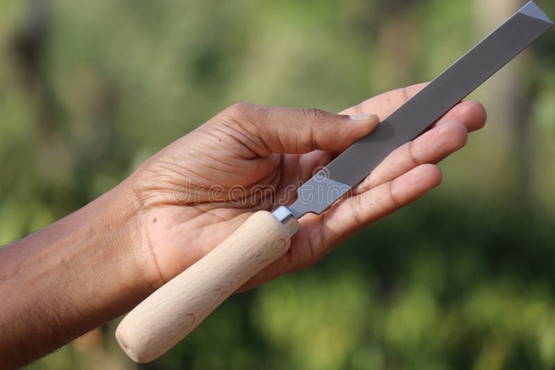 New Iron File Tool with Wooden Handle Held in the Hand Isolated on ...