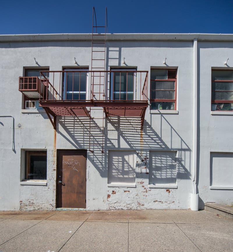 Iron Fire Escape with Shadows Stock Photo - Image of emergency, metal ...