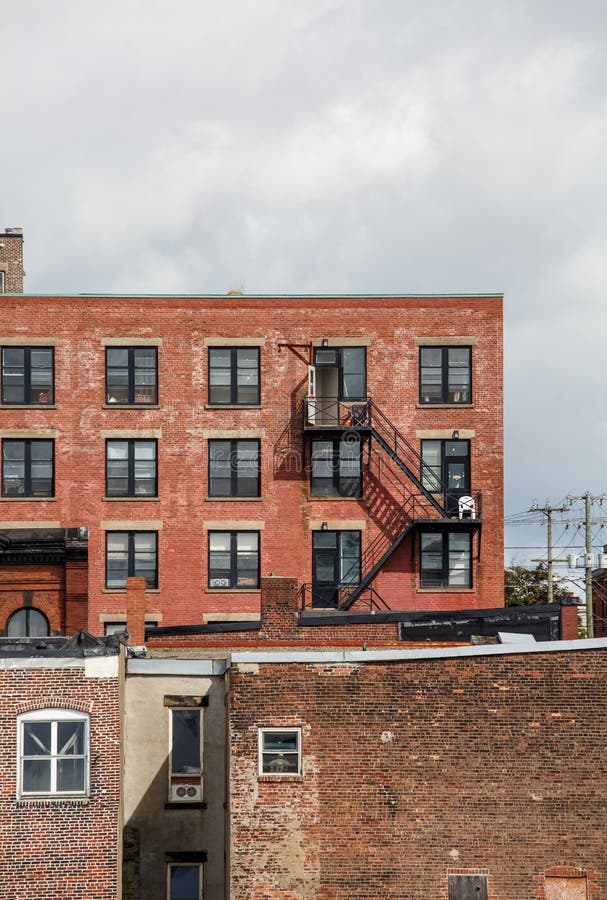 Iron Fire Escapes on Old Brick Buildings Stock Photo - Image of ...
