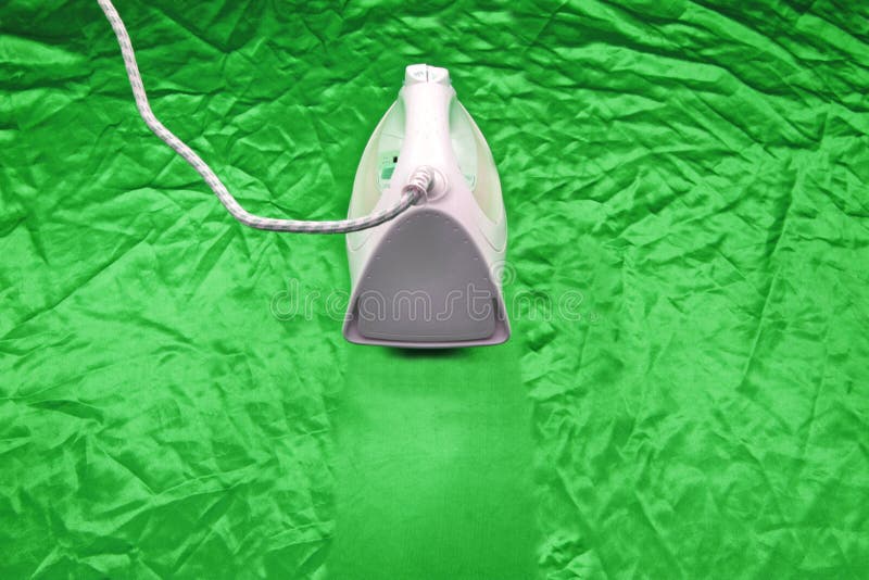 Iron on Freen Crinkle Silk Fabric Stock Photo - Image of cleaning ...