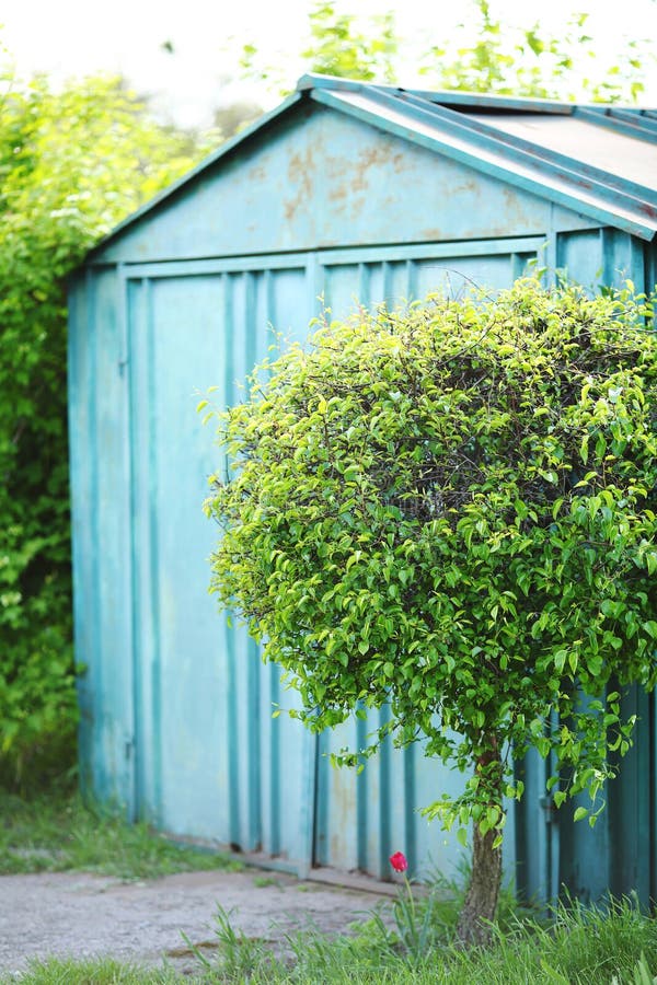 One Old Red Iron Garage with Closed Gates Stock Photo - Image of ...