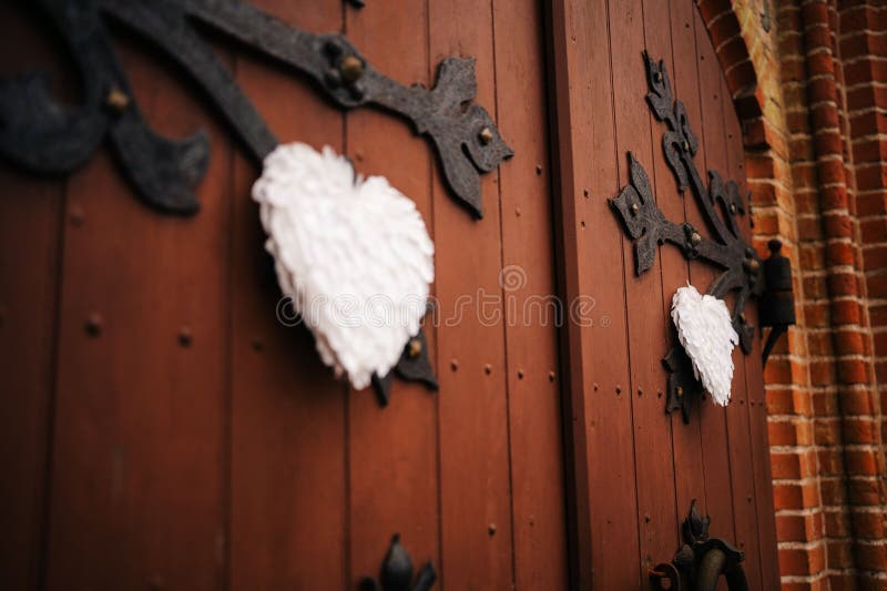 Iron Gate Adorned with Several White Hanging Hearts, Symbolizing Love ...