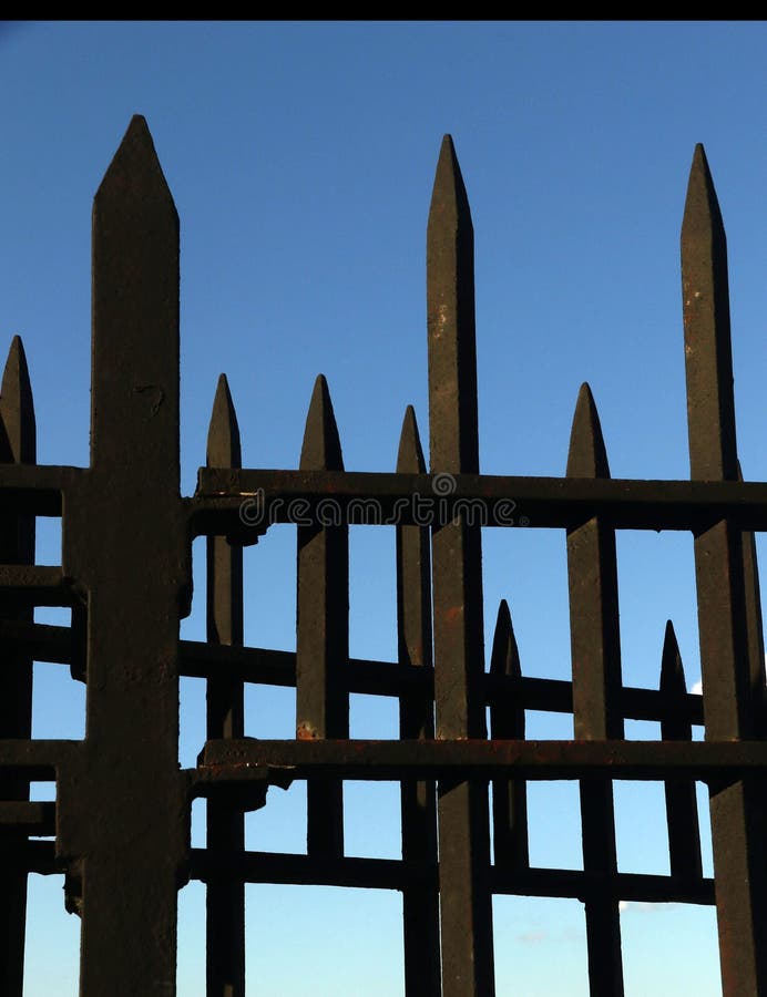 Iron gate against blue sky stock image. Image of gate - 94942861