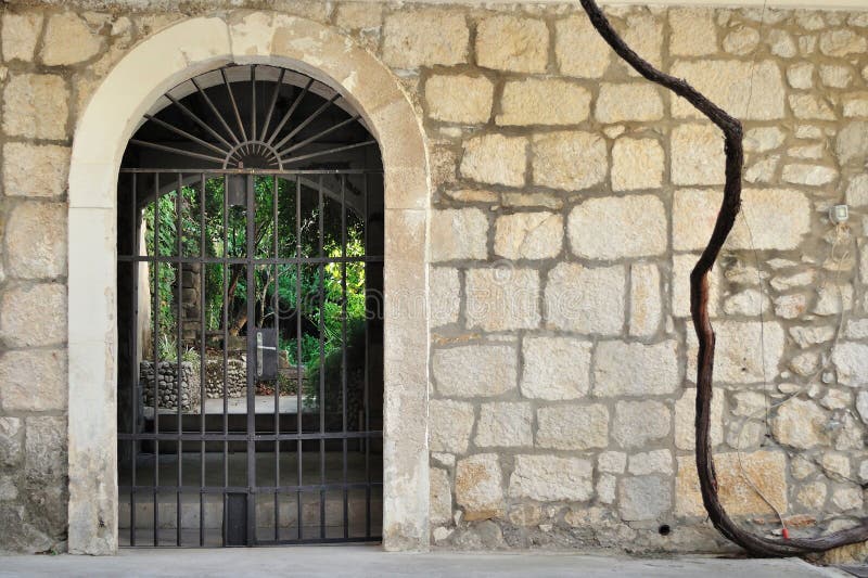 Iron Gate in Ancient Stone Wall Stock Image - Image of exterior ...