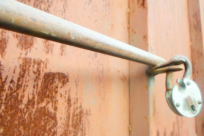Iron Gate Covered with Rust and a Large Lock on the Gate. Texture of a ...