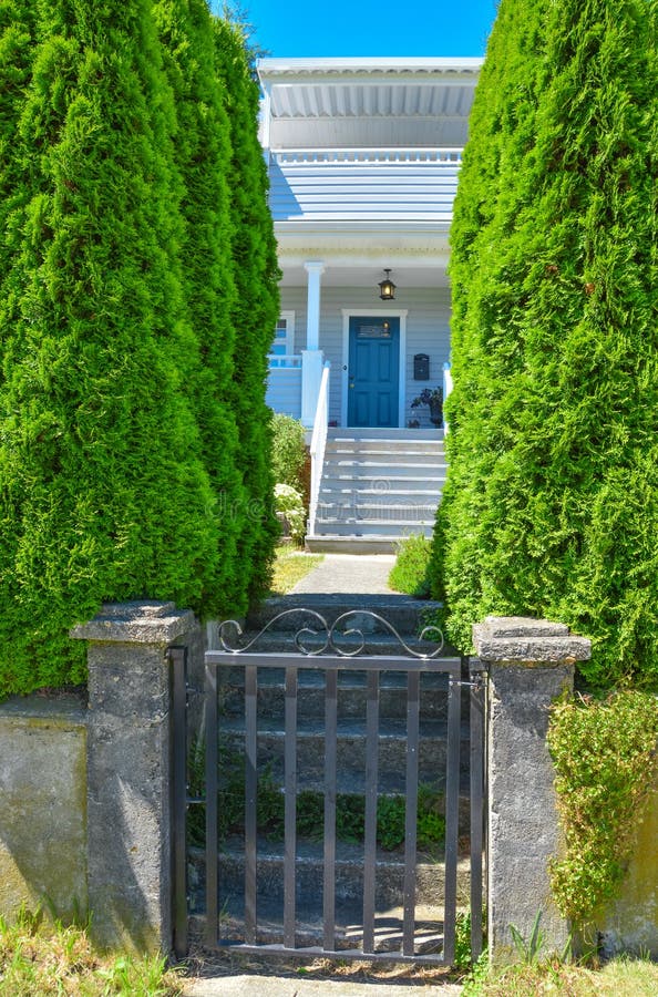 Iron Gate in Front of the House with Steps and Pathway Leading the ...