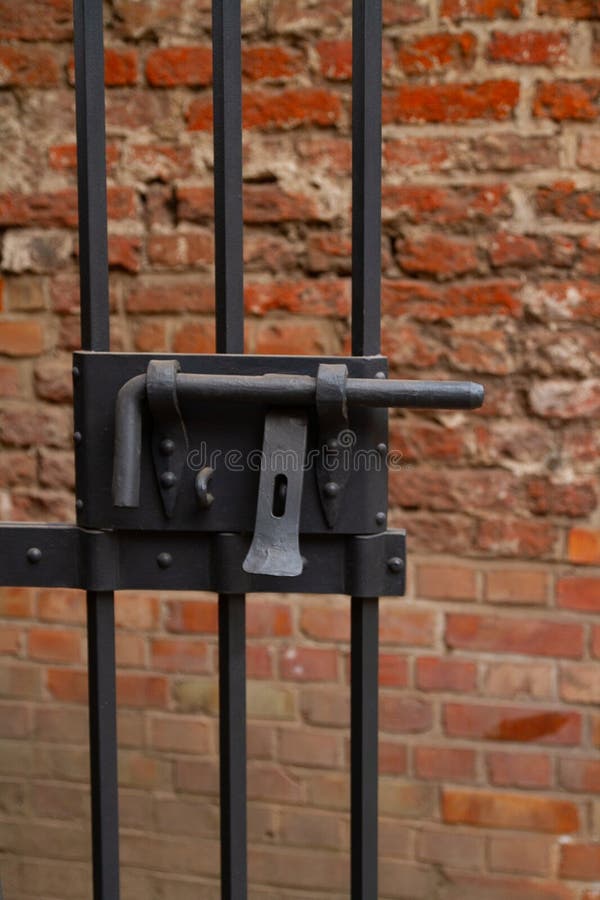 Iron Gate Locked with a Padlock Stock Photo - Image of light, wall ...