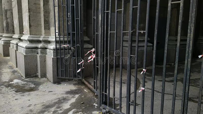 Iron Gate with Torn and Warning Red and White Tapes. Stock Footage ...