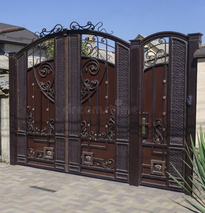 Iron gate with wicket stock image. Image of doorway - 258495561