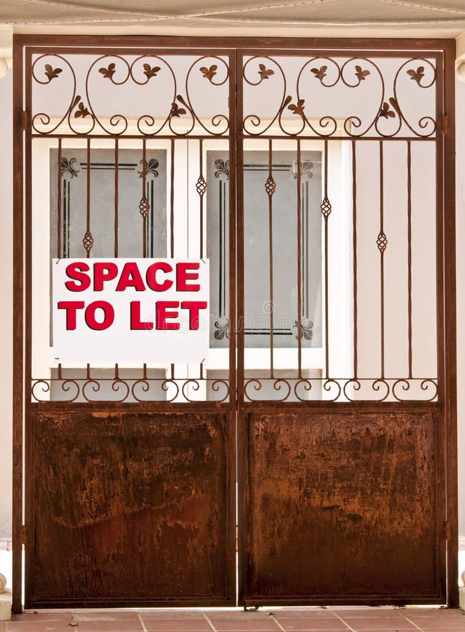 Iron Gates with the Sign Space To Let Stock Photo - Image of building ...