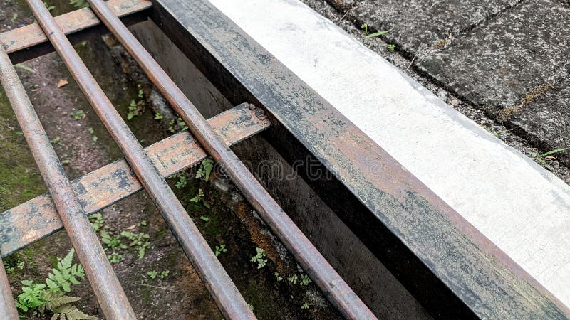 Iron Grate Drainage Channel on Pedestrian Path. Drains with Iron Bars ...