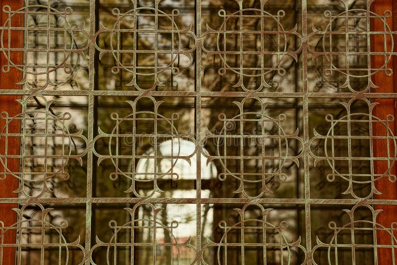 Iron Grating with a Pattern on the Window Glass Stock Photo - Image of ...
