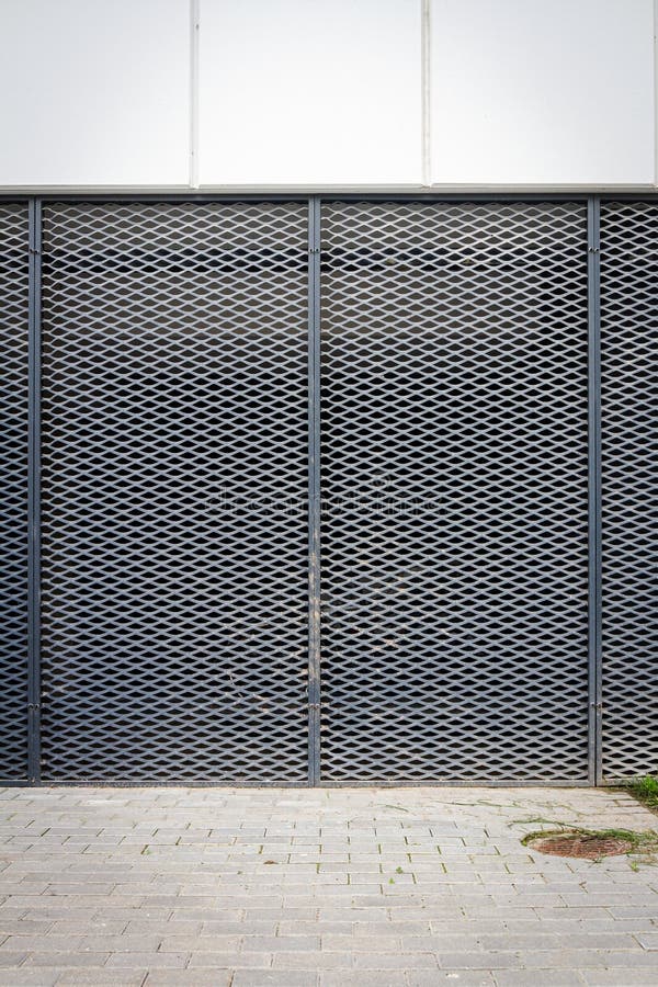 Iron Grid Wall and a Sidewalk Stock Image - Image of building, gray ...